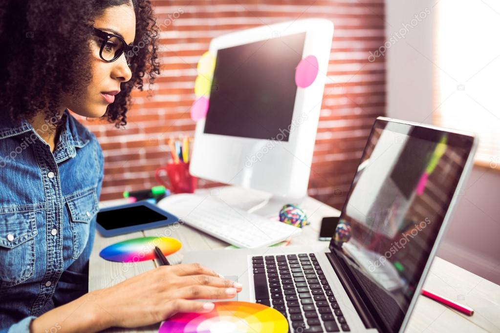 Designer using laptop — Stock Photo © Wavebreakmedia #84470634