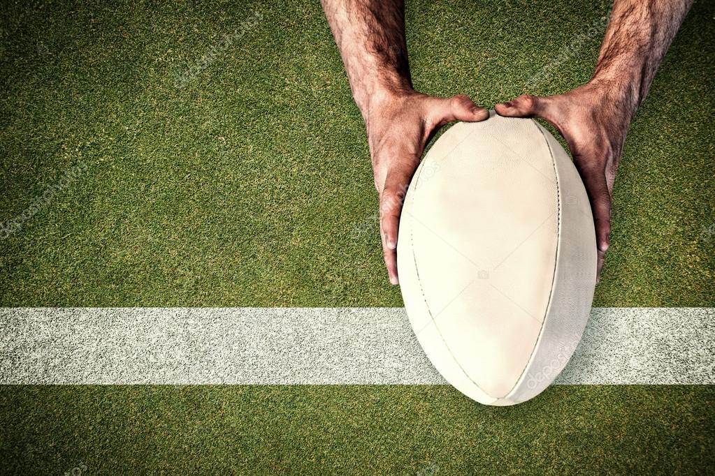 Man holding rugby ball Stock Photo by ©Wavebreakmedia 84685872