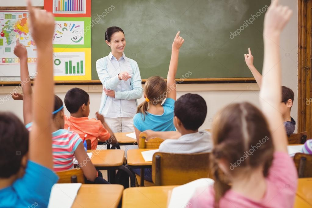 Teacher asking a question to her class Stock Photo by ©Wavebreakmedia ...