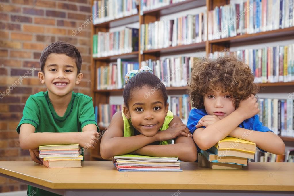 Students leaning upon school books — Stock Photo © Wavebreakmedia #84696396
