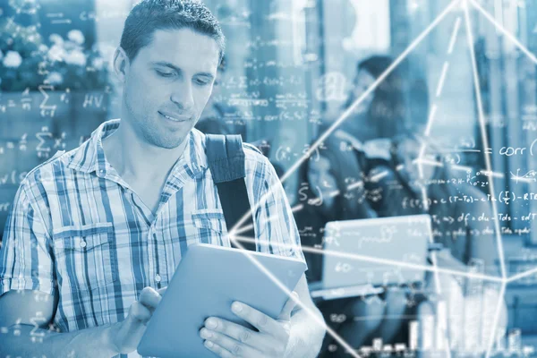 Student using his tablet pc on campus - Stock Image - Everypixel
