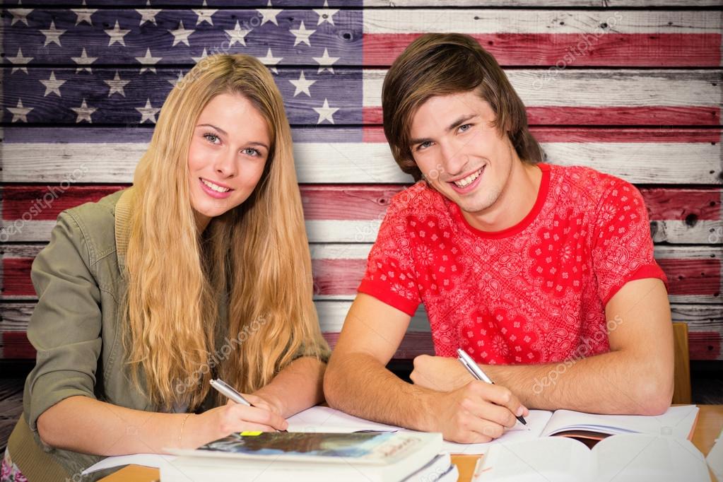 Students studying against usa flag Stock Photo by ©Wavebreakmedia 84705260