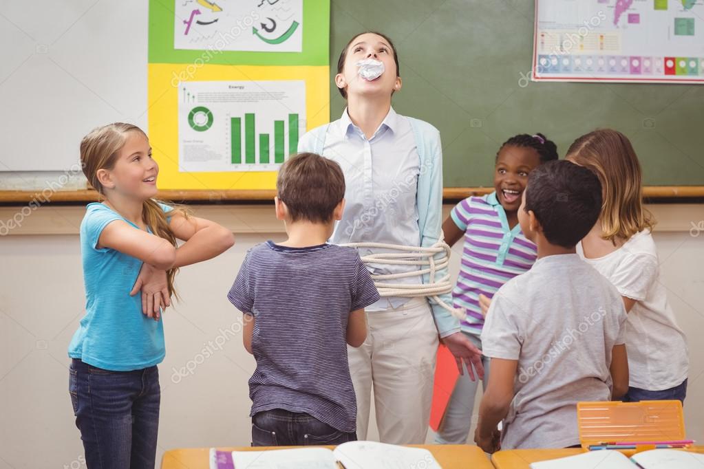 Pupils running wild in classroom — Stock Photo © Wavebreakmedia #84707734