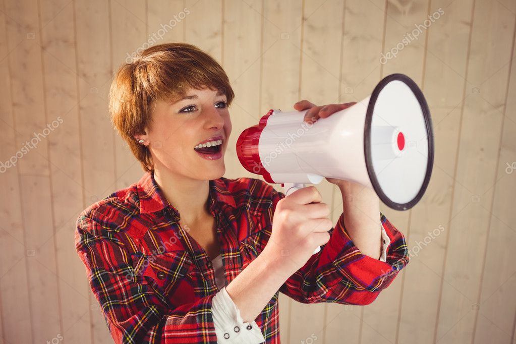 Pretty young woman using megaphone Stock Photo by ©Wavebreakmedia 84910172