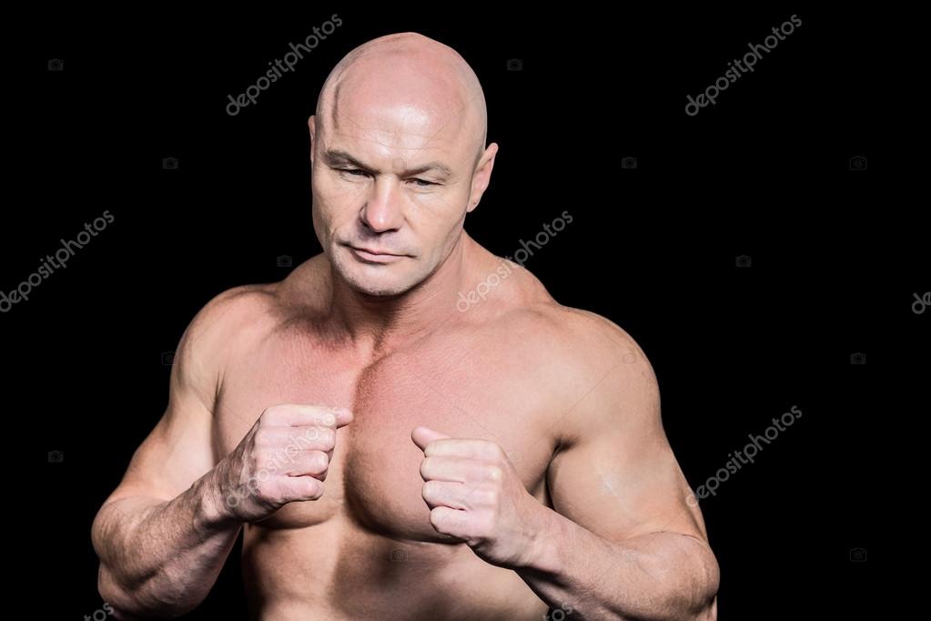 Bald man in boxing pose — Stock Photo © Wavebreakmedia #84917970