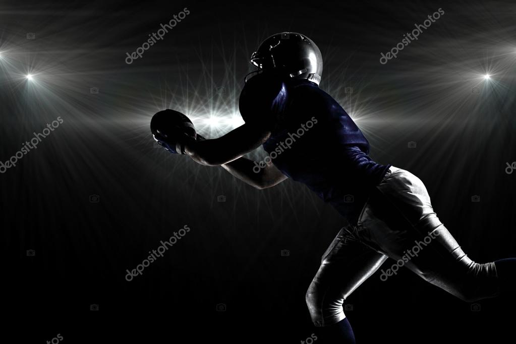 American football player catching ball — Stock Photo © Wavebreakmedia ... American football player catching ball — Stock Photo © Wavebreakmedia ...