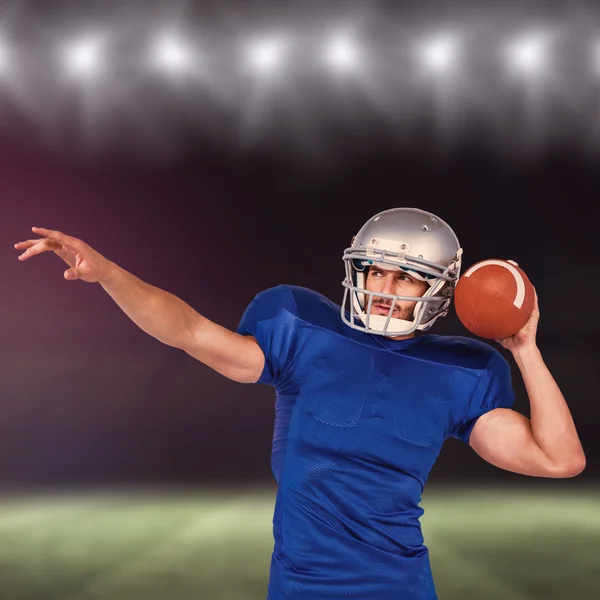 Football player about to throw ball - Stock Image - Everypixel