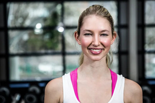 Fit woman smiling at camera - Stock Image - Everypixel