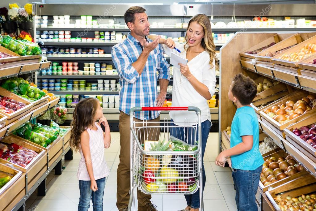 Happy family doing shopping Stock Photo by ©Wavebreakmedia 98085758
