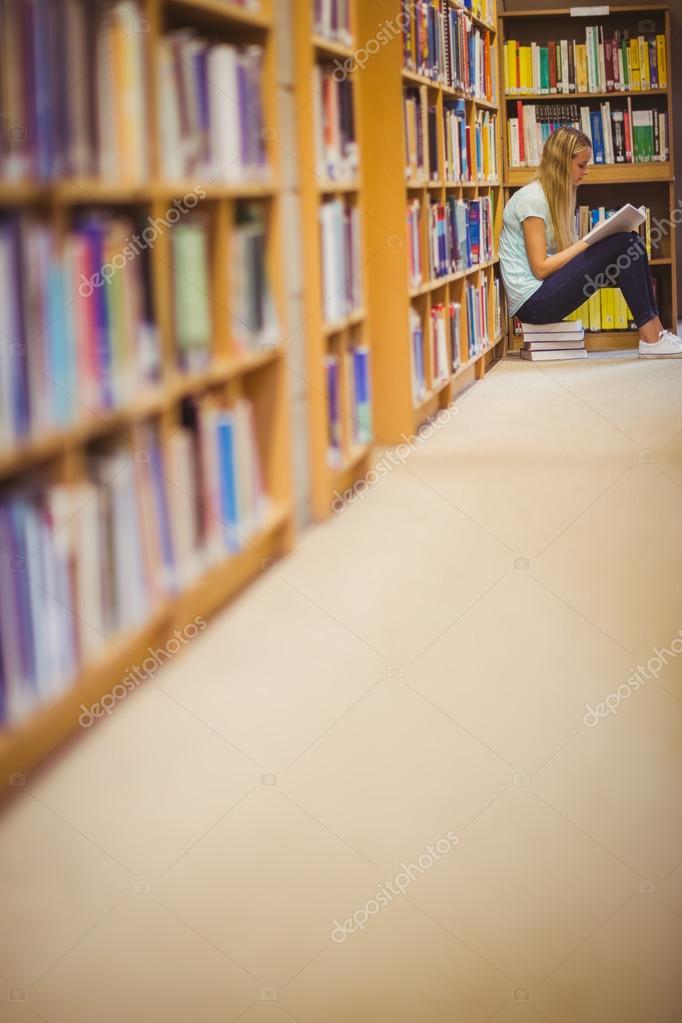 Blonde student reading — Stock Photo © Wavebreakmedia #98101472