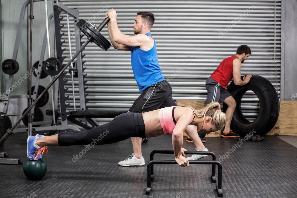 Fit people doing exercises — Stock Photo © Wavebreakmedia #98270904