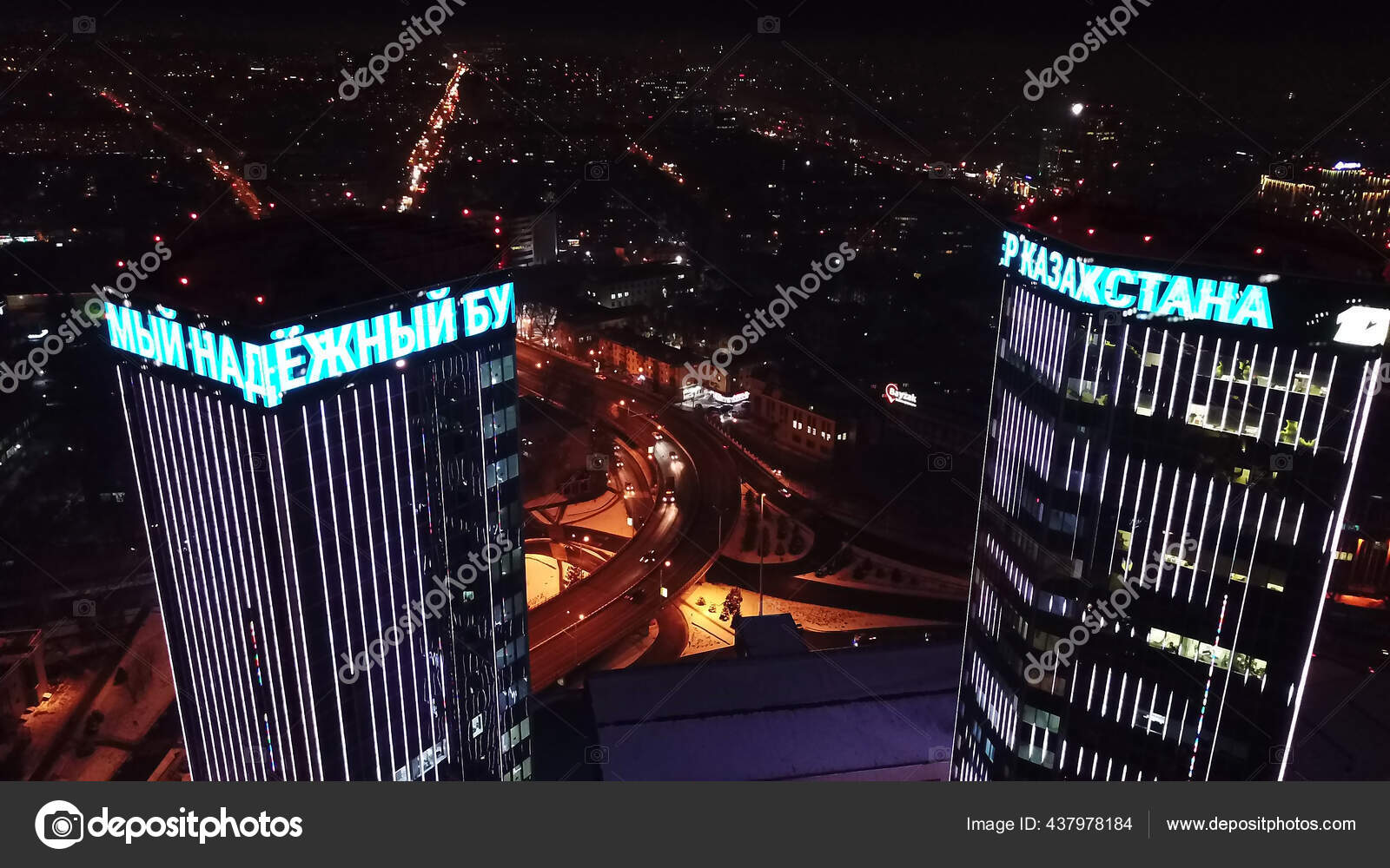 Two tall identical buildings with neon lights. — Stock Editorial Photo ...