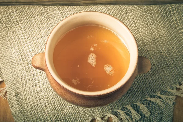 Clay pot with ghee and spoon on linen napkin. Rustic still life. Stock ...