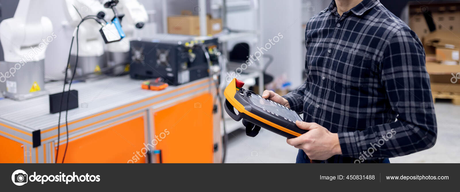 Engineer operator controls automatic mechanical robot arm to weld and collect car parts — Stock ...