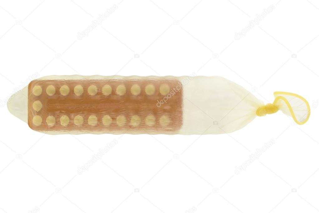 A new package of birth control pills inside a yellow unused condom ...