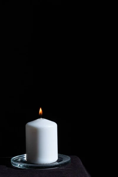 burning candle against light blue background - Stock Image - Everypixel
