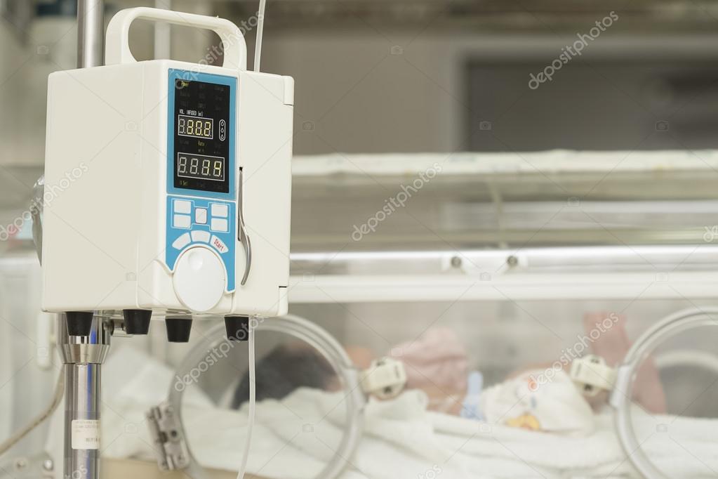 Infusion pump feeding IV drip into baby's patients Stock Photo by ...