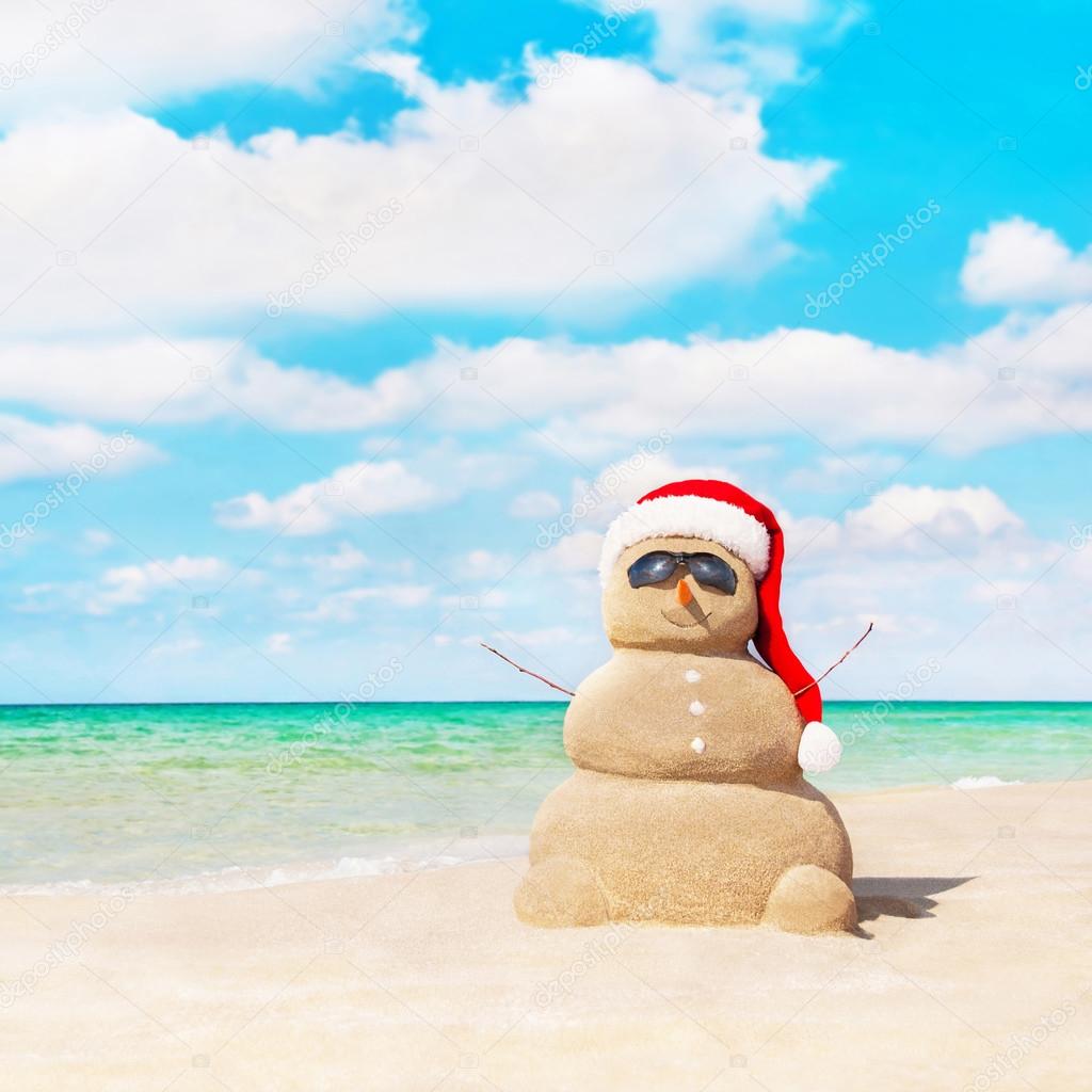 Sandy snowman at beach. — Stock Photo © EM_prize #60646619