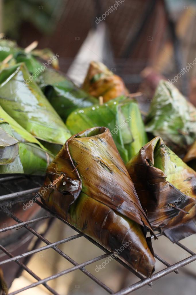Sticky rice wrapped in banana leaves grill Stock Photo by ©luknaja 62021365
