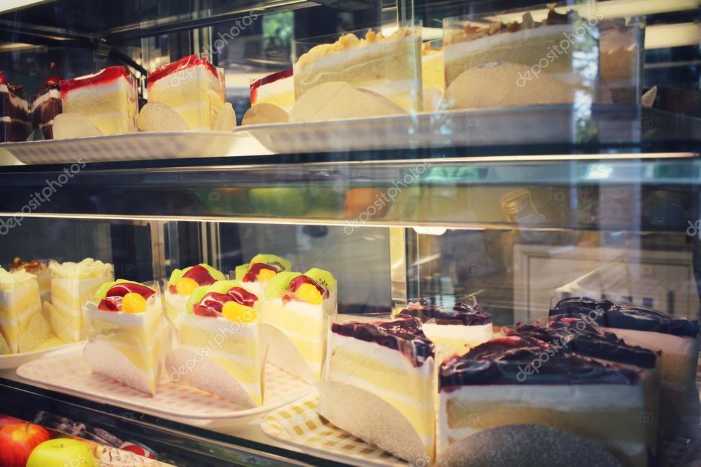 Cakes at coffee shop Stock Photo by ©luknaja 72004577