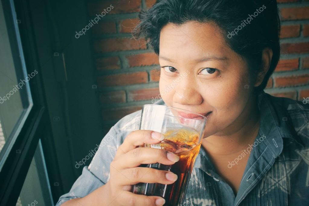 Woman drinking a cola Stock Photo by ©luknaja 77293802