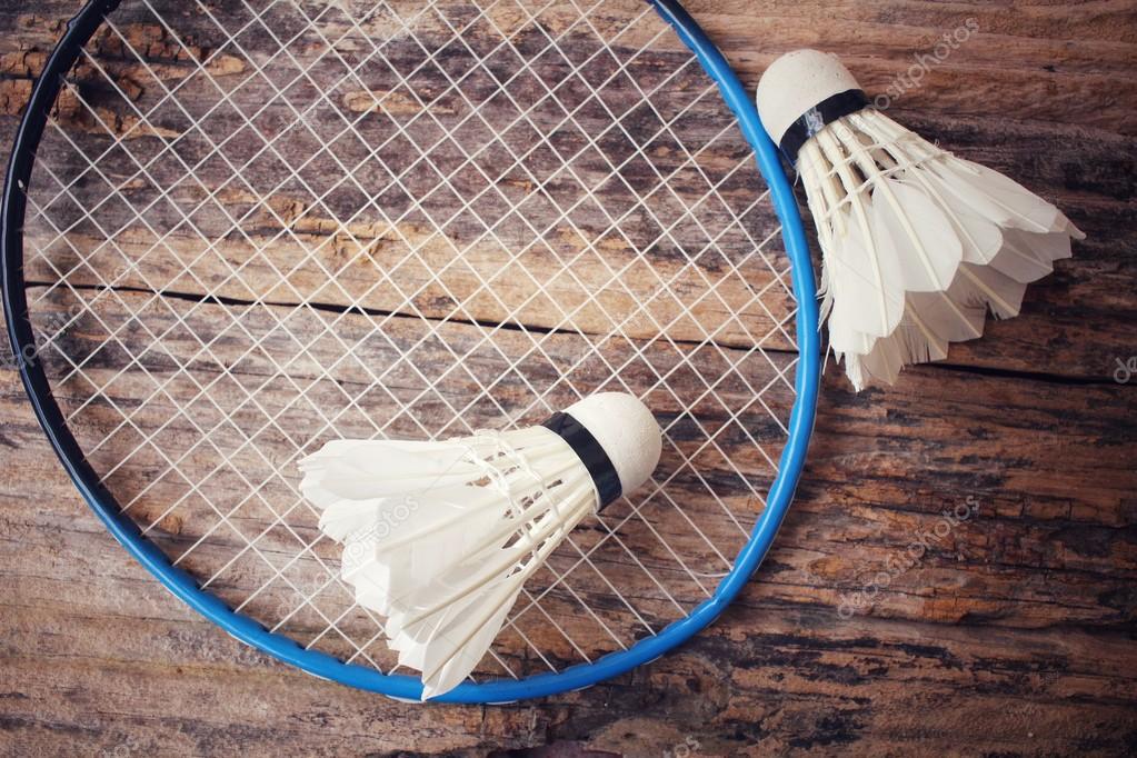 Shuttlecocks with badminton racket. Stock Photo by ©luknaja 80199142