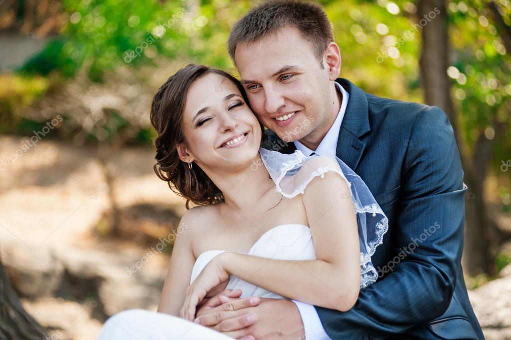Bride and groom hugging Stock Photo by ©fly_wish 63403801