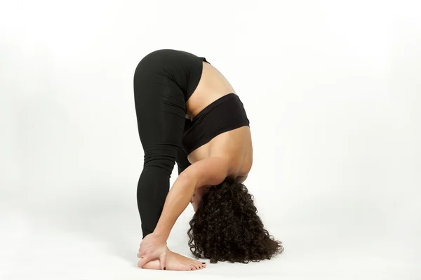 Standing in front bend pose Stock Photos, Royalty Free Standing in ...