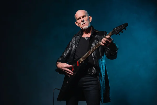 Bald heavy metal senior man Stock Photo by ©ysbrand 100191504