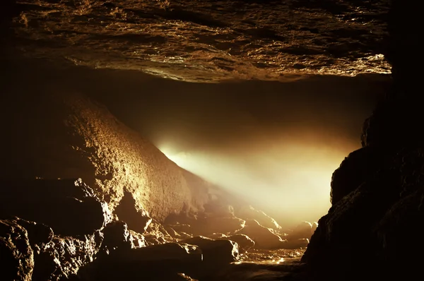 Light in a cave with limestone deposits — Stock Photo © photocosma ...