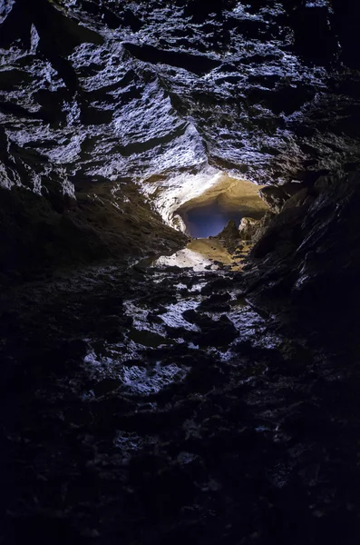 Light in a cave with limestone deposits — Stock Photo © photocosma ...