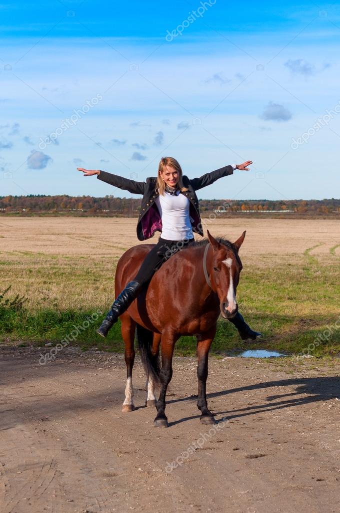 Beautiful woman walking with horse — Stock Photo © DeathLess #55324081