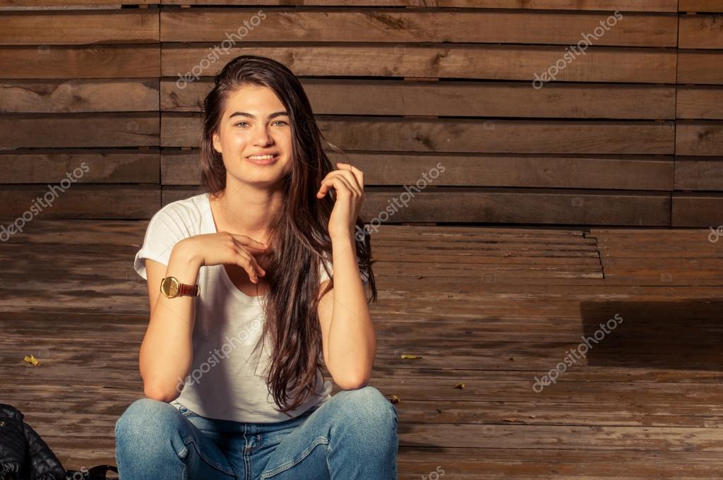 Cute female model smiling wearing jeans and t-shirt ⬇ Stock Photo ...