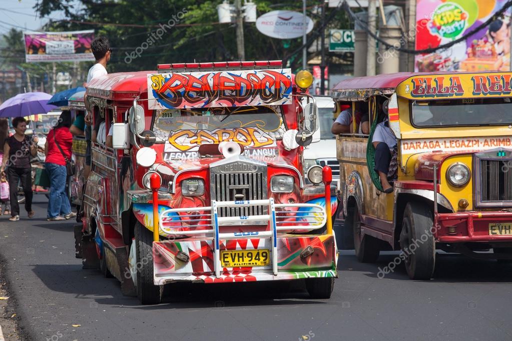 Jeepneys passing, Filipino inexpensive bus service. Philippines ...