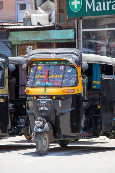 Auto rickshaw taxi on a road in Srinagar, Kashmir, India. – Stock ...