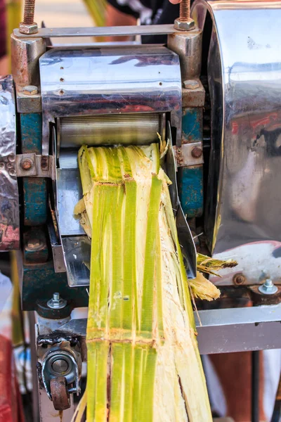Sugar cane juice and machine to extract it Stock Photo by ...