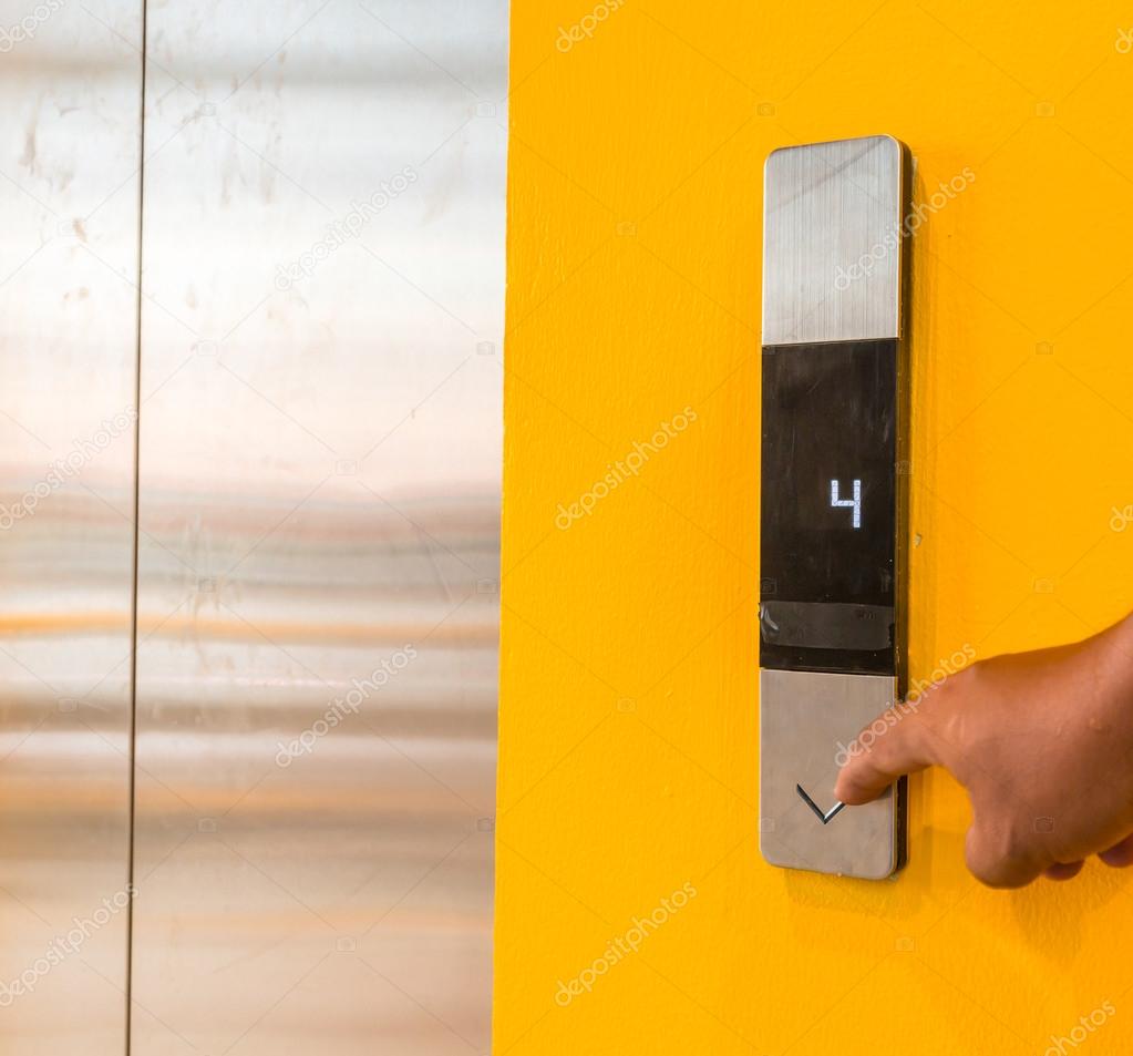 Pressing elevator button Stock Photo by ©Deerphoto 84929250