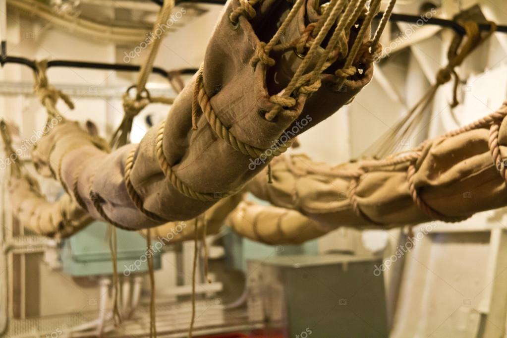 Rolled hammocks in ship crew quarters are stowed — Stock Photo ...