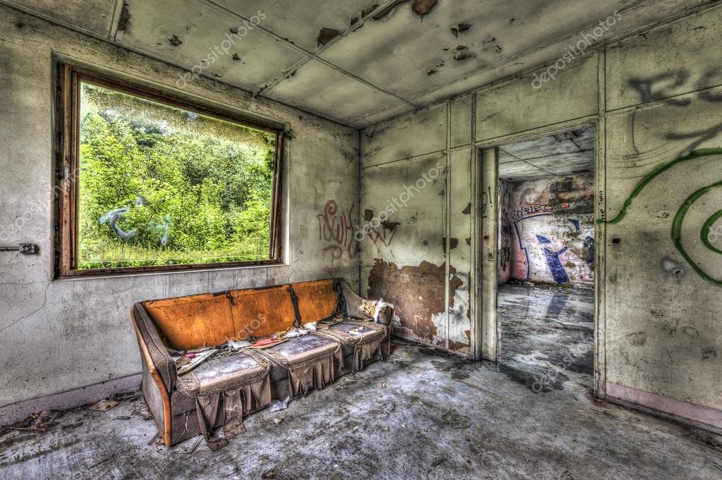 Rotten sofa in an abandoned room Stock Photo by ©PBphotos 114897012