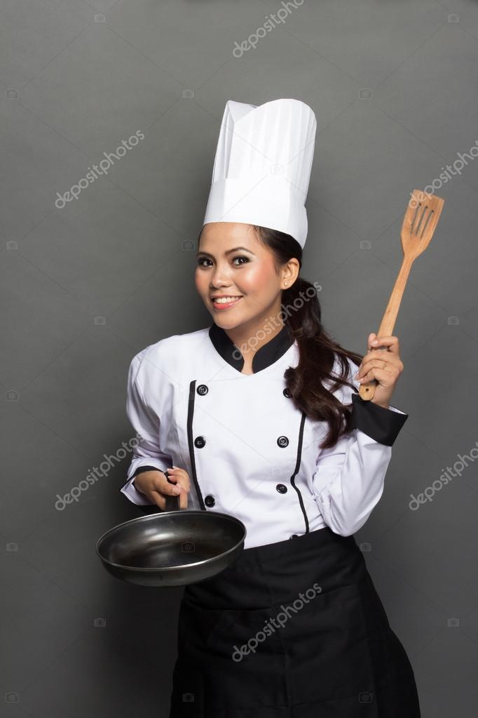 Female chef ready to cook Stock Photo by ©odua 63487571