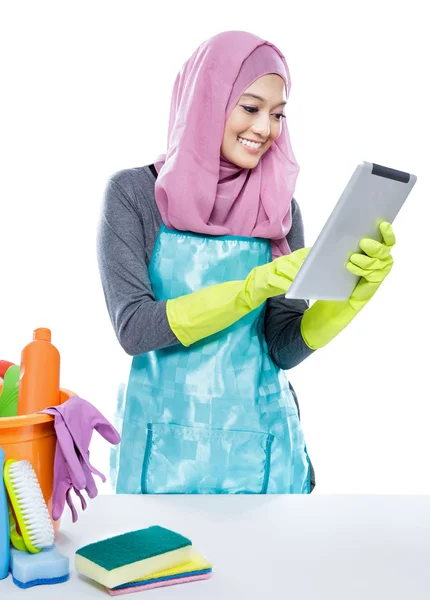 Young housewife carrying many bottles of cleaning fluid Stock Photo by ...