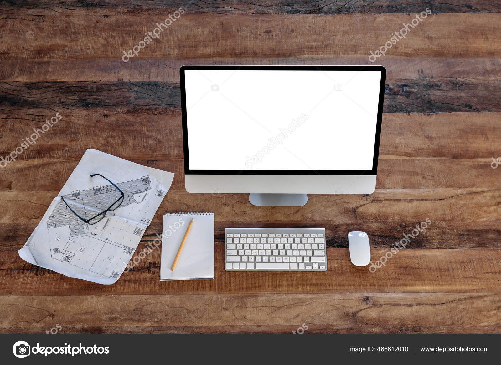 Top view at a computer monitor with a blank white screen for your ...