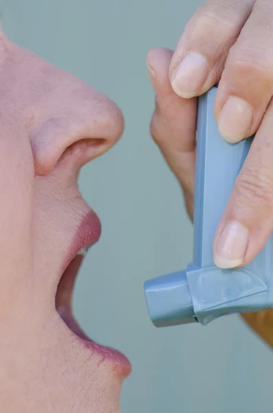 Close up woman with asthma using inhaler - Stock Image - Everypixel