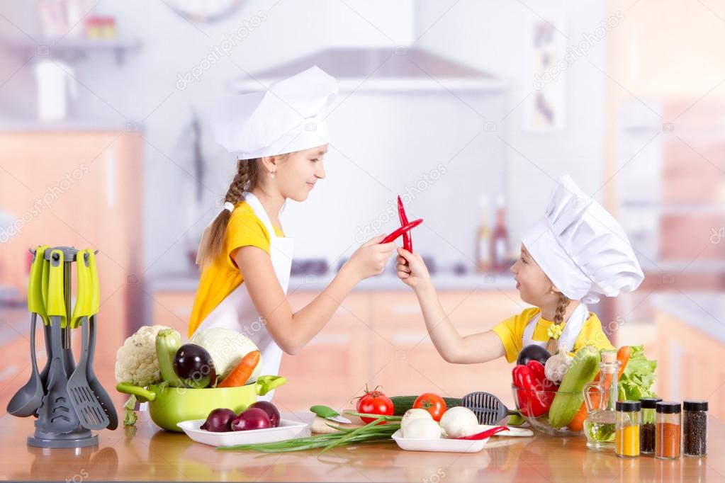 Two girls having fun in the kitchen — Stock Photo © dadooda #96003874