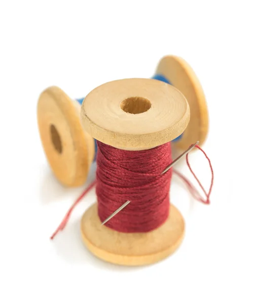Spool of thread and needle on white Stock Photo by ©seregam 114207522