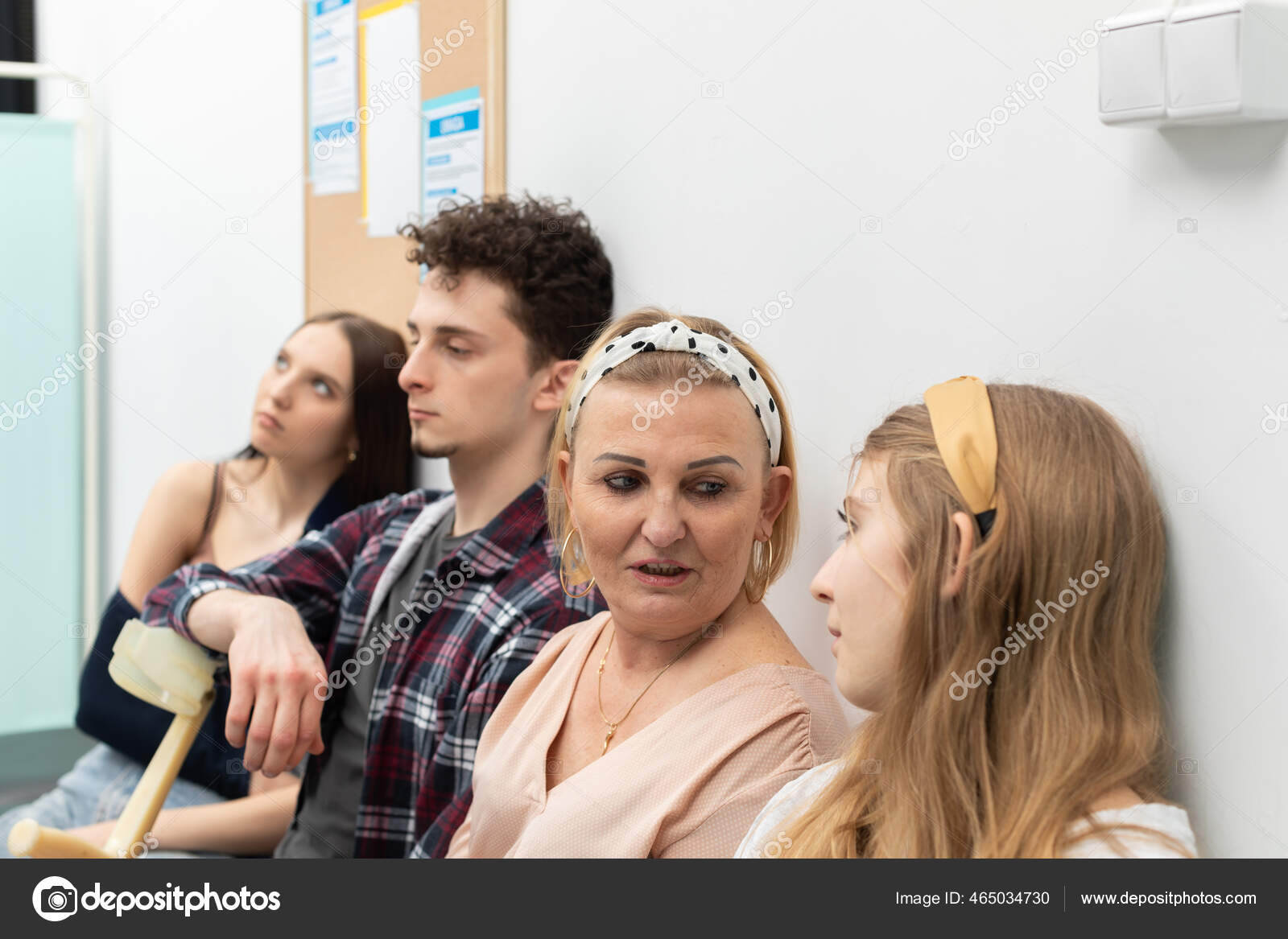 Patients in line to see the doctor discuss who goes into the doctors ...