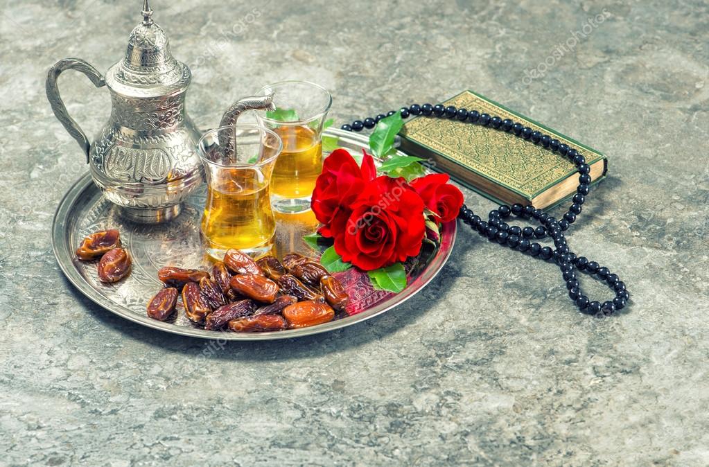 Tea, red rose flower, dates, holy book quran and rosary. Islamic Stock ...
