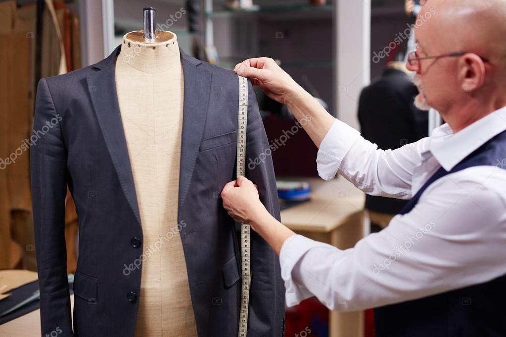Tailor taking measures — Stock Photo © pressmaster #101042868