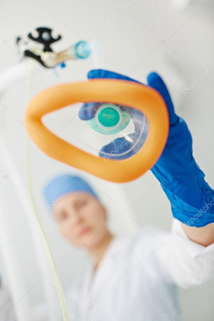 Putting on oxygen mask — Stock Photo © pressmaster #112554588