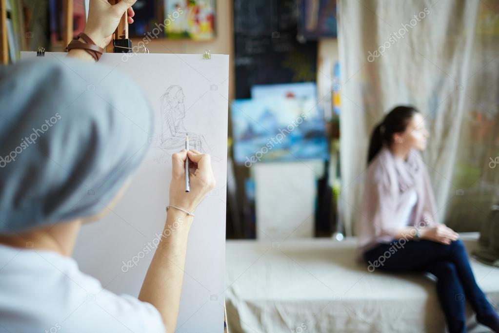 Student drawing a woman in studio Stock Photo by ©pressmaster 112561168